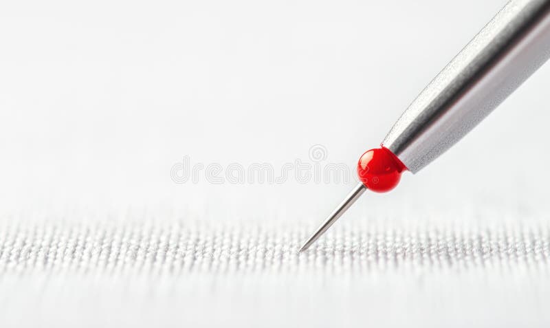 A Crisp, Close-up Captures a Red Pin Precisely Piercing a Textured ...