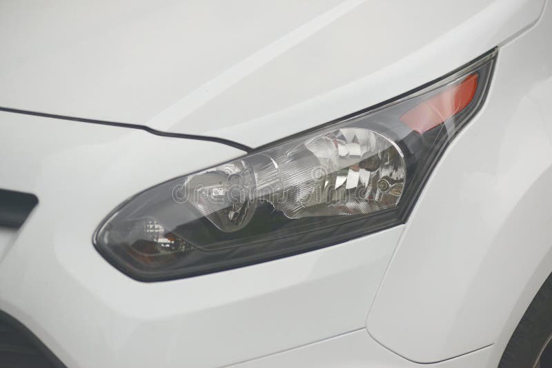 Close-Up of Modern Halogen Headlight on White Vehicle with Clean Design ...