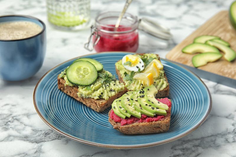 Crisp Rye Toasts with Avocado Stock Photo - Image of bread, plate ...
