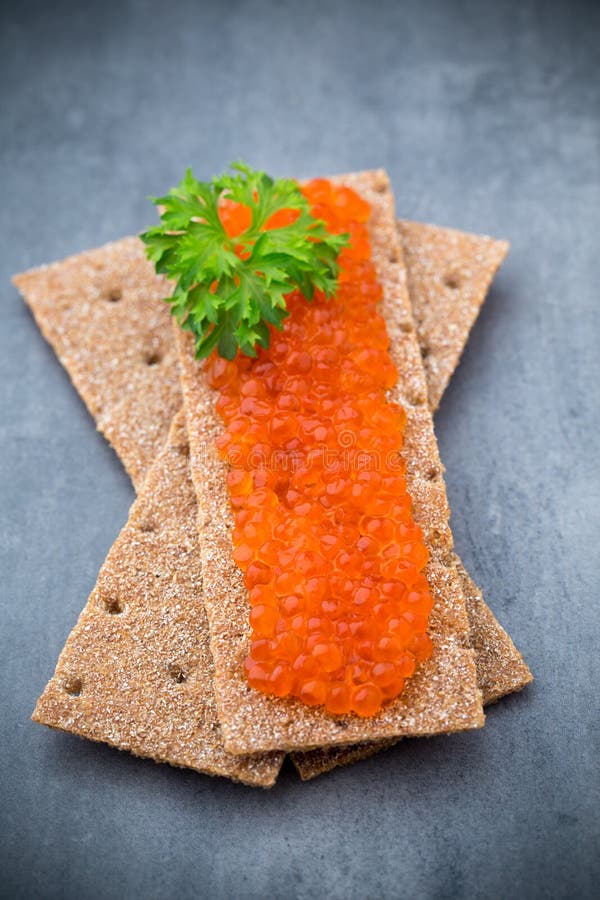 Crispbread with Soft Cheese with Herbs and Salmon Roe. Stock Image ...