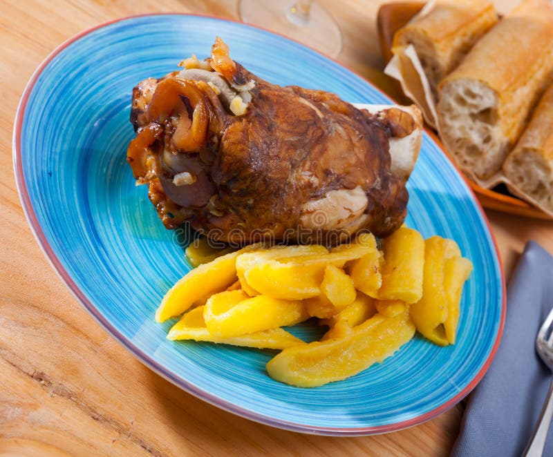 Crispy baked pork knuckle stock photo. Image of tender - 258569364