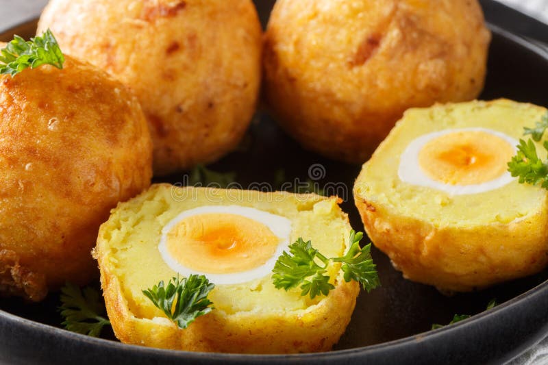 Crispy Balls of Cassava Puree with Eggs, Deep Fried Close-up in a Plate ...