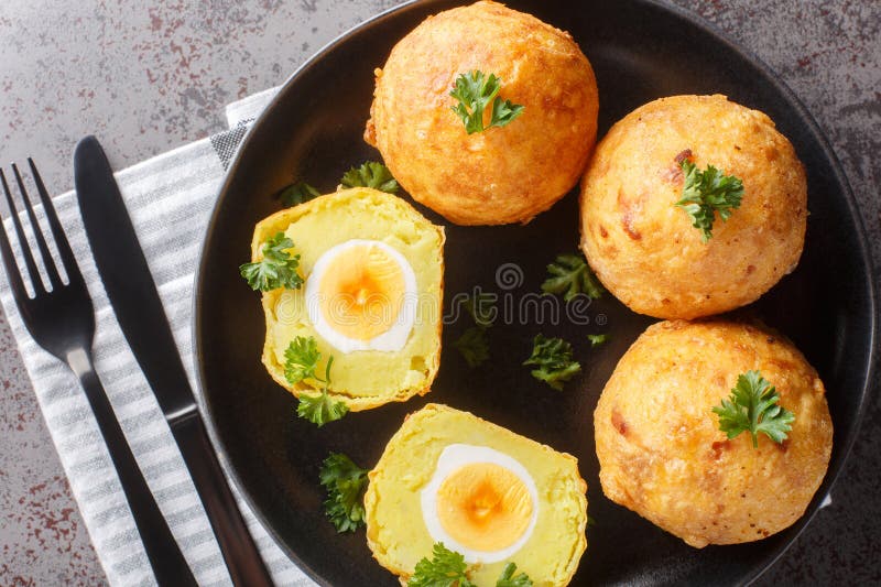 Crispy Balls of Cassava Puree with Eggs, Deep Fried Close-up in a Plate ...