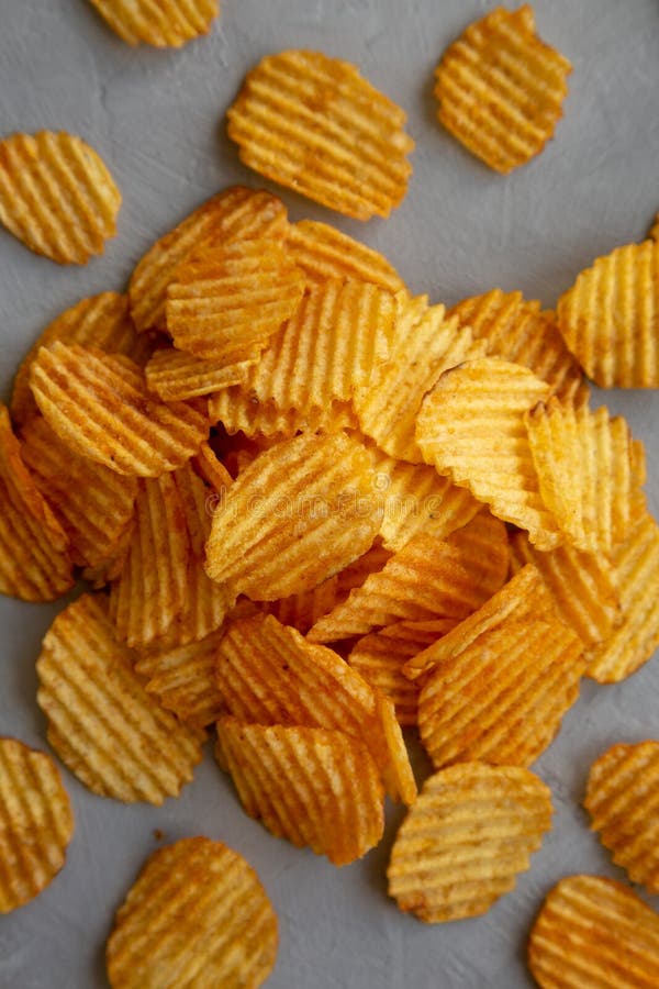 Crispy Barbeque Potato Chips on a Gray Surface, Top View. Flat Lay ...