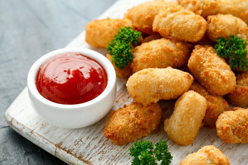 Crispy Battered Scampi Nuggets with Ketchup and Mayonnaise on Rustic ...