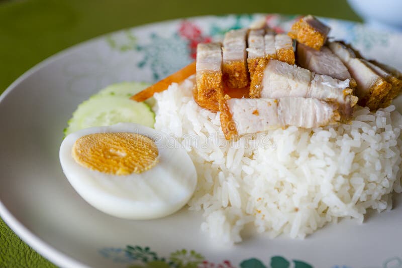 Crispy Belly Pork on Rice and Egg with Barbecue Red Sauce Stock Image ...