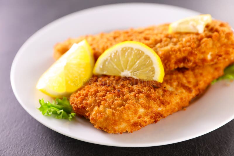 Crispy breaded fish fillet stock image. Image of cookery - 209254355