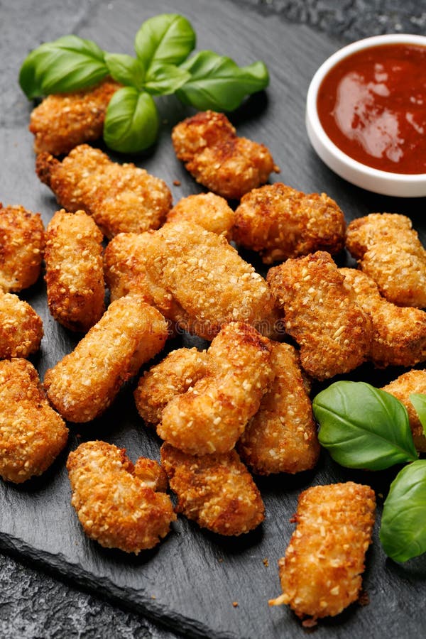 Crispy Breaded Scampi Nuggets with Sauce on Stone Board Stock Photo ...