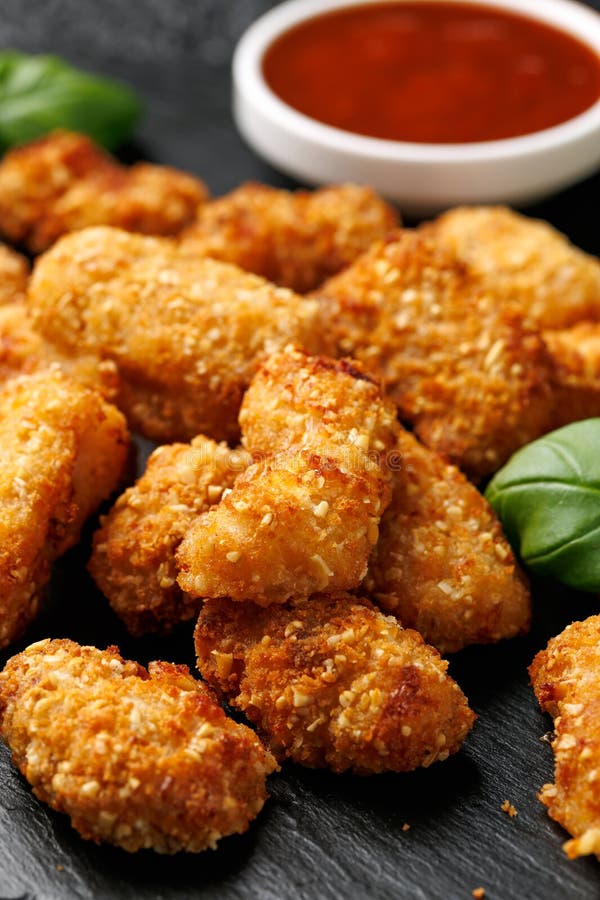 Crispy Breaded Scampi Nuggets with Sauce on Stone Board Stock Image ...