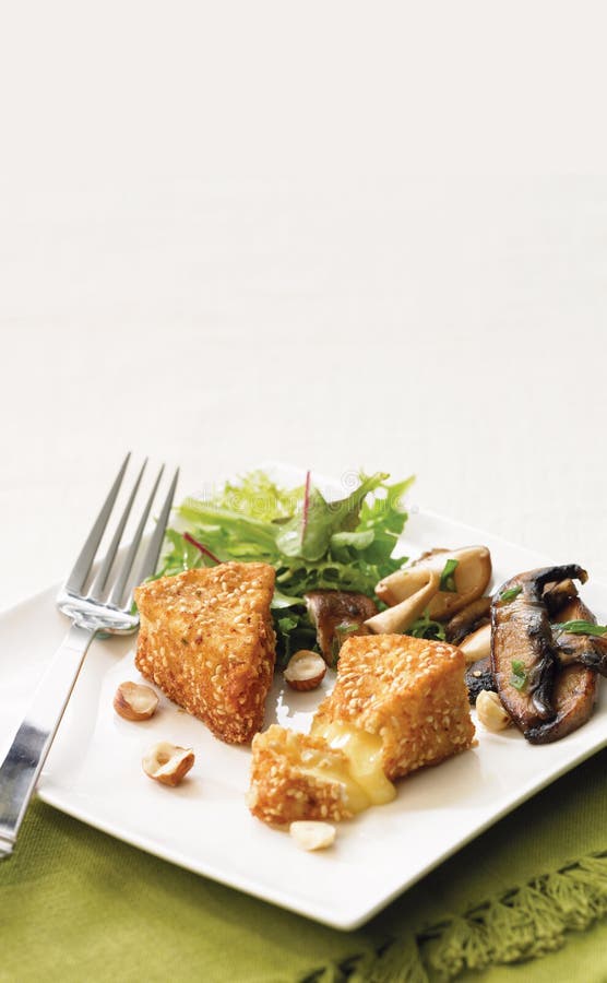 Crispy Camembert with Mushrooms and Hazelnuts Stock Photo - Image of ...