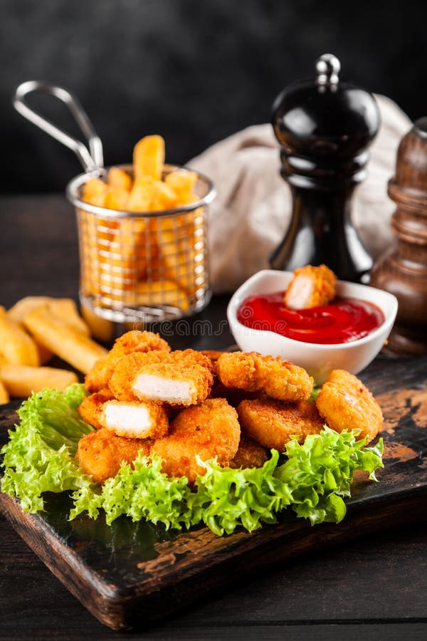 Crispy chicken nuggets stock photo. Image of nuggets - 144928940