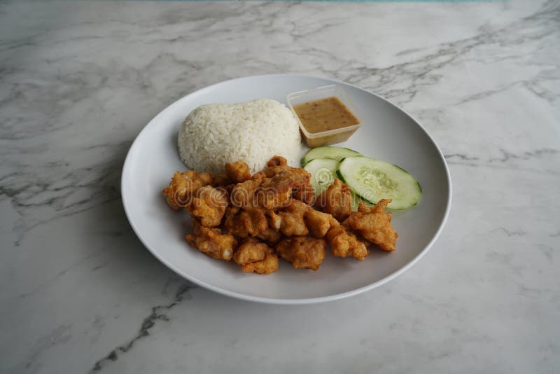 Crispy Chicken Pop Corn Served with Rice and Salted Egg Sauce Stock ...