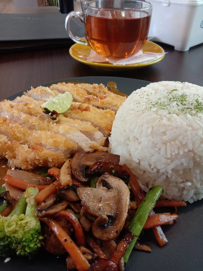 Crispy Chicken Rice with Broccoli and Mushrooms Stock Photo - Image of ...