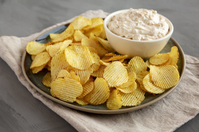 Crispy Crinkle Potato Chips and French Onion Dip on a Plate, Side View ...