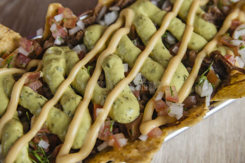 Crispy and Delicious Plate of Nachos with Sauce Stock Image - Image of ...