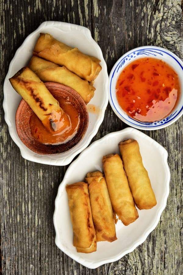 Crispy Egg Rolls and Dipping Sauces on Wood Tabletop Stock Photo ...