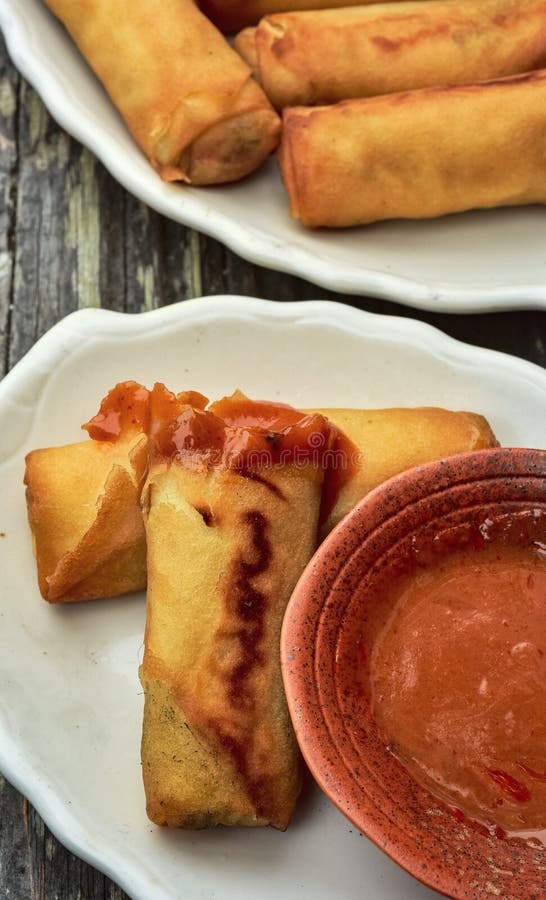 Crispy Egg Rolls and Dipping Sauces on Wood Tabletop Stock Image ...