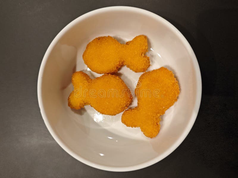 Crispy Fish Shaped Chicken Nuggets for the Kids Menu Stock Image ...