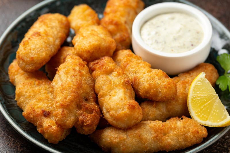 Crispy Fish Strips with Tartar Sauce in a Plate Stock Photo - Image of ...