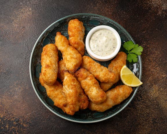 Crispy Fish Strips with Tartar Sauce in a Plate Stock Photo - Image of ...
