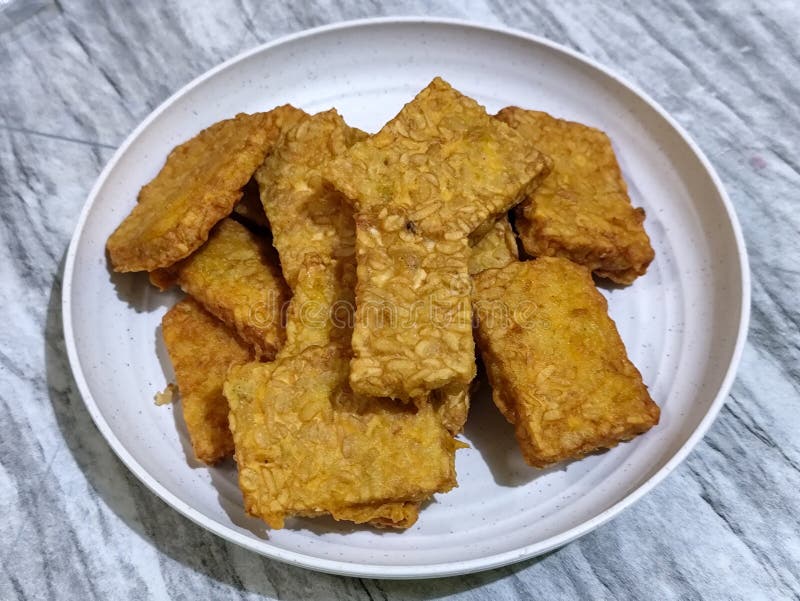 Crispy flour fried tempeh. stock photo. Image of people - 365092598