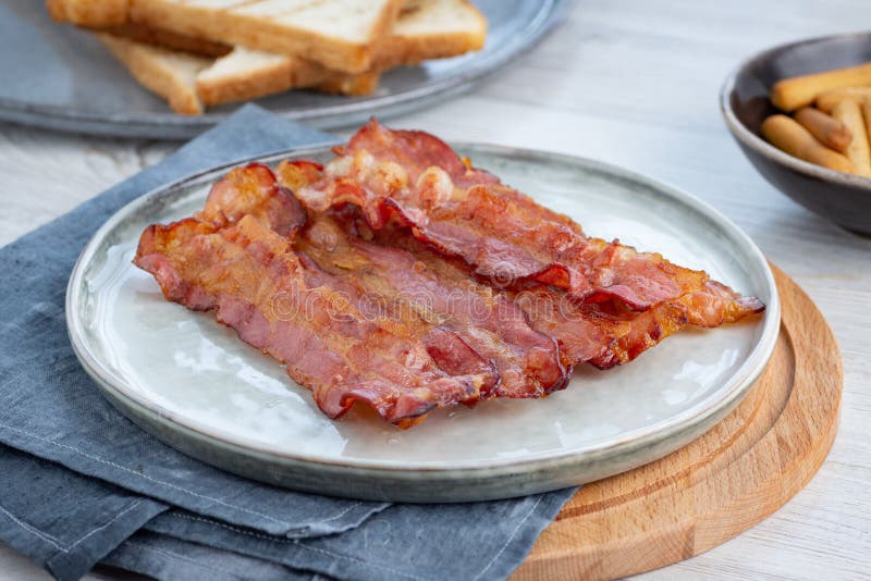 Crispy Fried Bacon on a Plate Stock Photo - Image of food, appetizer ...