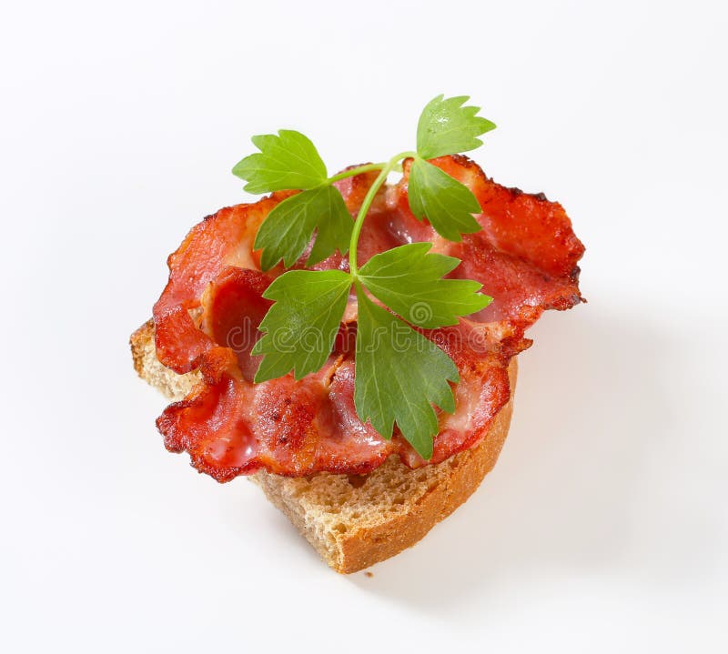 Crispy Fried Bacon on a Slice of Bread Stock Image - Image of studio ...