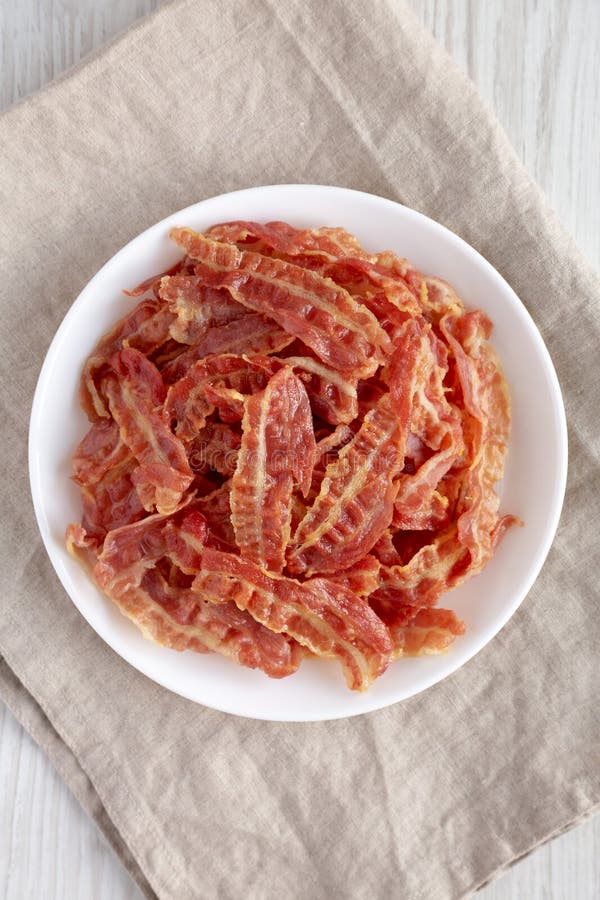 Crispy Fried Bacon on a White Plate, Top View. Flat Lay, Overhead, from ...