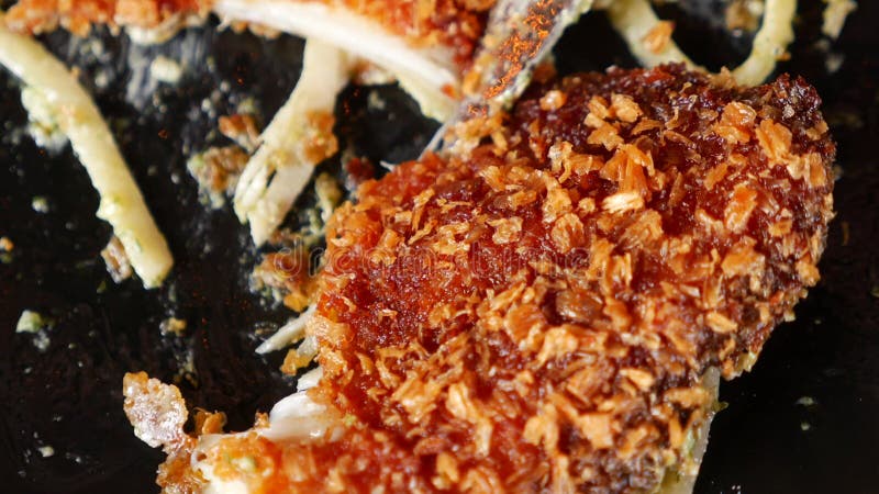 Crispy Fried Fish Fillet Preparation with Flavorful Toppings Stock ...