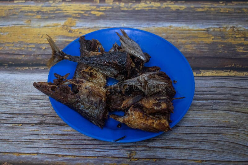 Crispy Fried Fish Pieces Displayed on a Blue Plate, Ready To Be Enjoyed ...