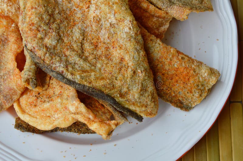 Crispy Fried Fish Skin with Seasoning on Dish Stock Image - Image of ...