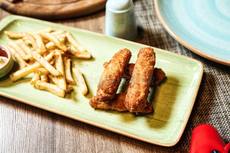 Crispy Fried Fish Sticks with Fries Stock Photo - Image of restaurant ...