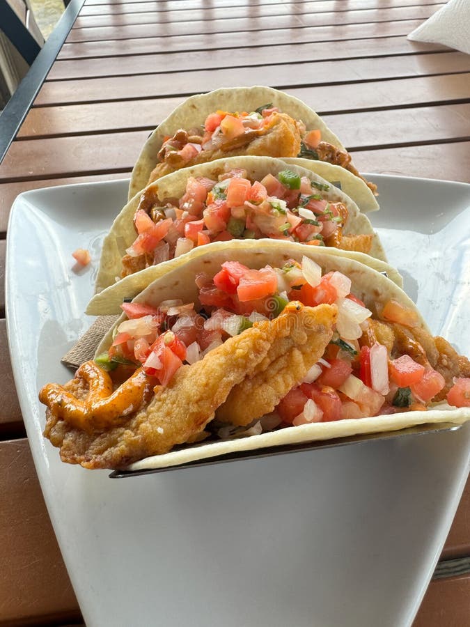 Crispy Fried Fish Tacos on a Table at an Outdoor Restaurant Stock Photo ...