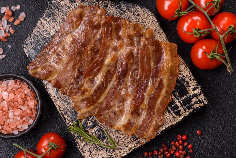 Crispy Fried Pork Bacon Sliced with Salt, Spices and Herbs Stock Image ...