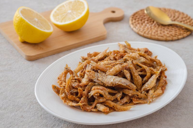 Crispy Fried Small Fish on White Plate Stock Photo - Image of nutrition ...