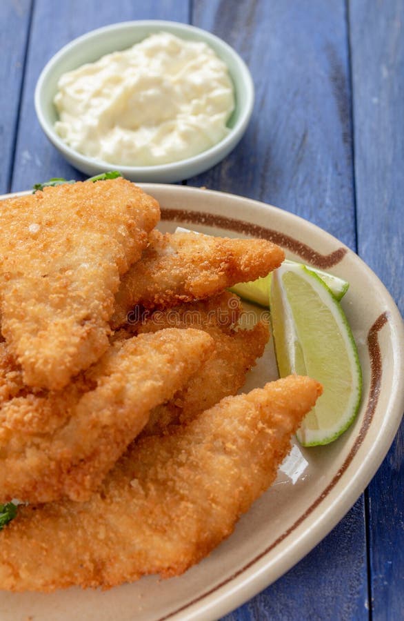 Crispy and Golden: Close-Up of Beer Battered Deep Fried Fish with Lemon ...