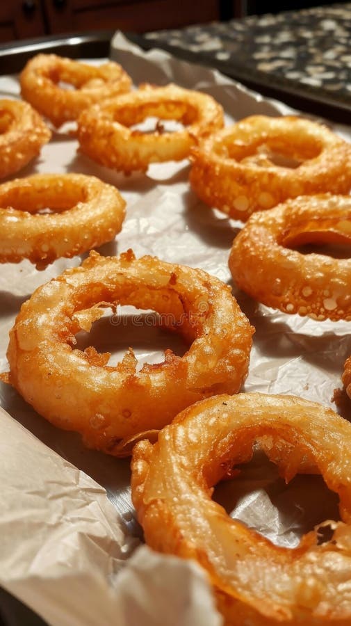 Crispy Golden Onion Rings on Baking Paper Stock Photo - Image of ready ...