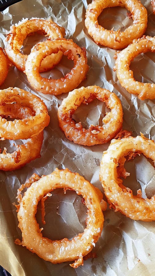 Crispy Golden Onion Rings on Parchment Paper Stock Photo - Image of ...