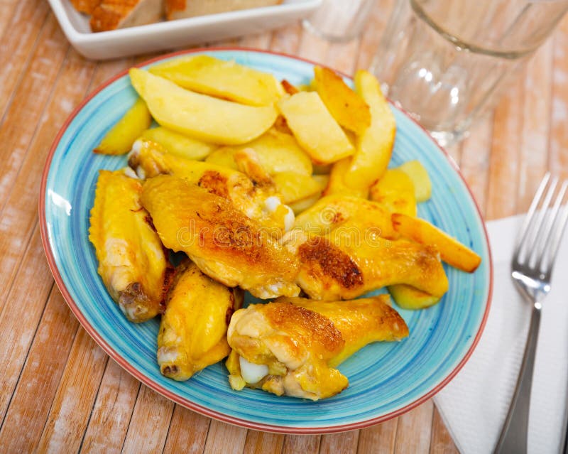 Crispy Grilled Chicken Wings Served with Potato Stock Image - Image of ...