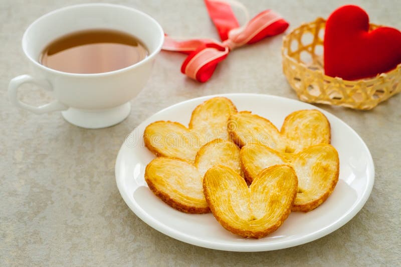 Crispy Heart or Butterfly Puff Pastry Cookie and Cup of Tea Stock Photo ...