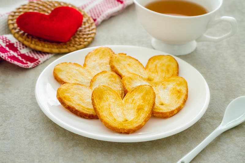 Crispy Heart or Butterfly Puff Pastry Cookie and Cup of Tea. Stock ...