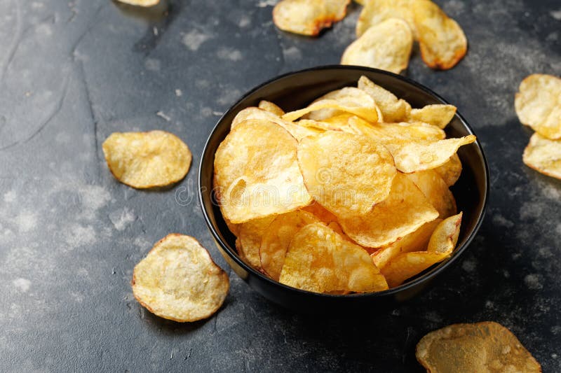 Crispy Potato Chips in Black Bowls. Snack Food Stock Image - Image of ...