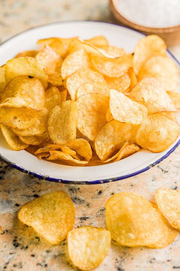 Crispy Potato Chips in Bowl on Kitchen Table Stock Photo - Image of ...