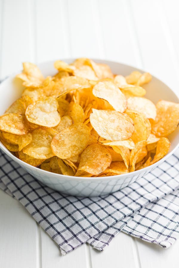 Crispy Potato Chips in Bowl on White Table Stock Photo - Image of ...