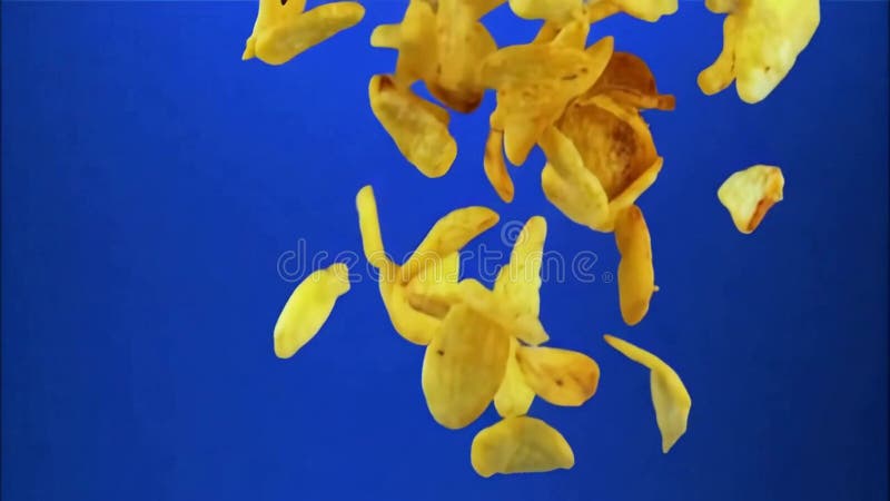 Potato chips falling. stock footage. Video of flavorful - 346722180
