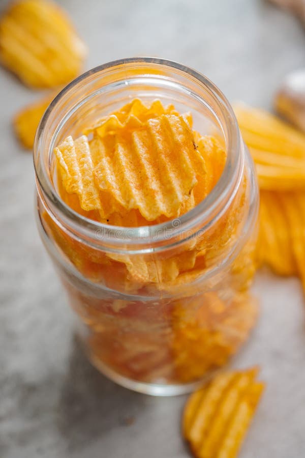 Crispy Potato Chips in Jar on Kitchen Table Stock Photo - Image of ...
