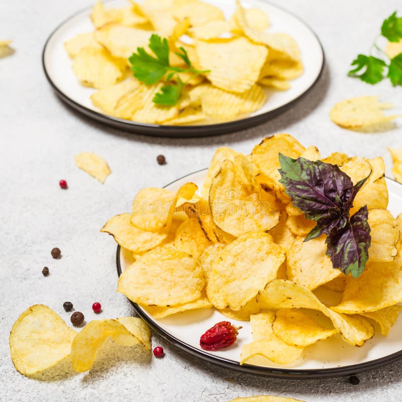 Crispy Potato Chips on a Plate Closeup Stock Photo - Image of chips ...