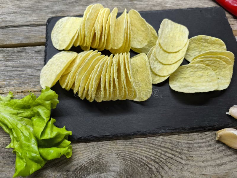 Crispy Potato Chips on a Sliced Board Stock Photo - Image of delicious ...