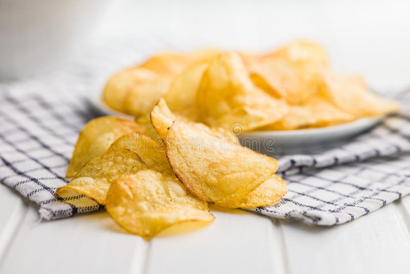 Crispy Potato Chips on White Table Stock Photo - Image of salty, snack ...