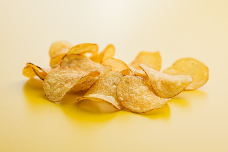 Crispy Potato Chips Falling through Air with Bokeh Background Stock ...